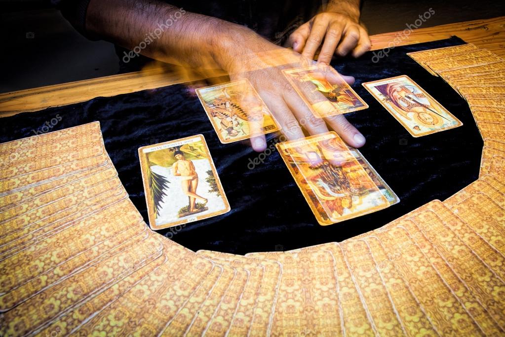 Man hand playing tarrot cards with slow speed — Stock Photo ...