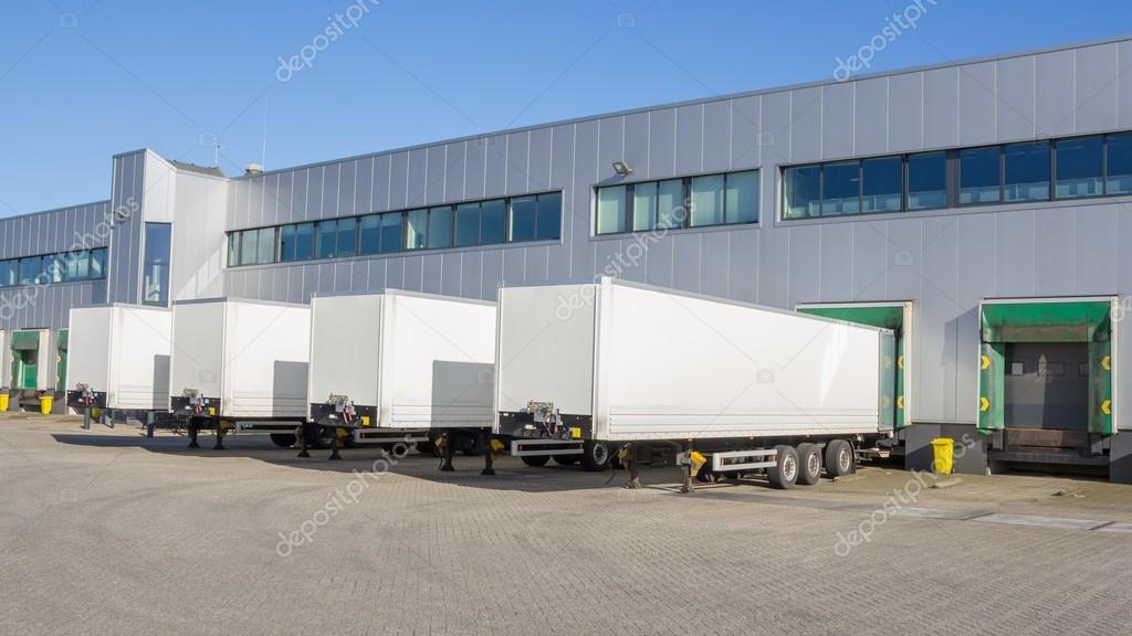 Trailers at docking stations of a distribution center waiting to be ...