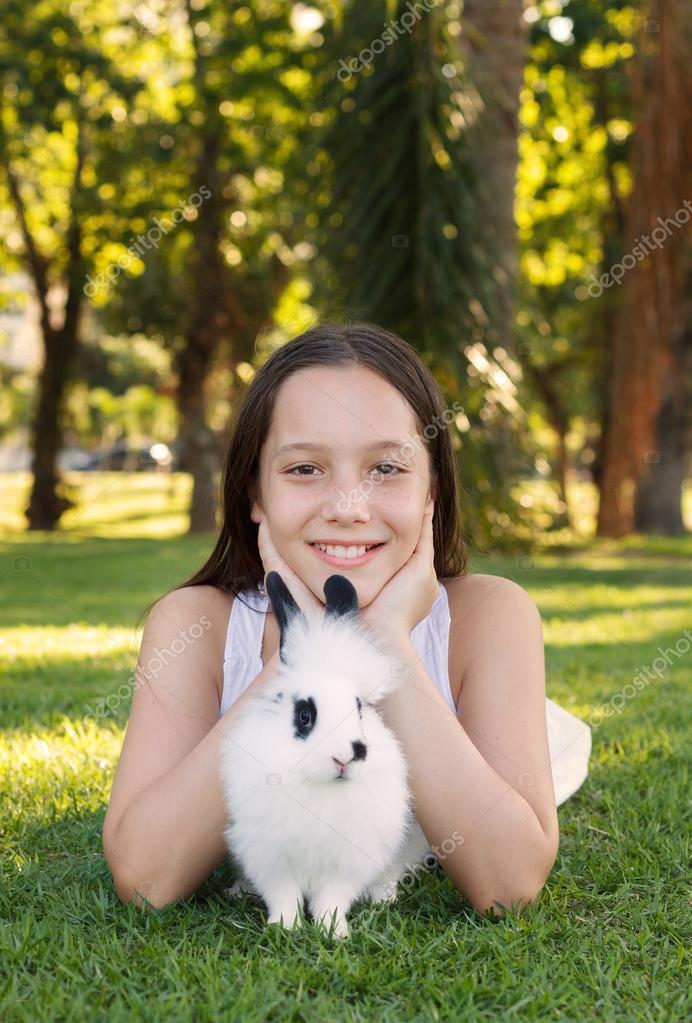 Cute beautiful smiling teen girl with white-black baby rabbit — Stock ... Cute beautiful smiling teen girl with white-black baby rabbit — Stock ...