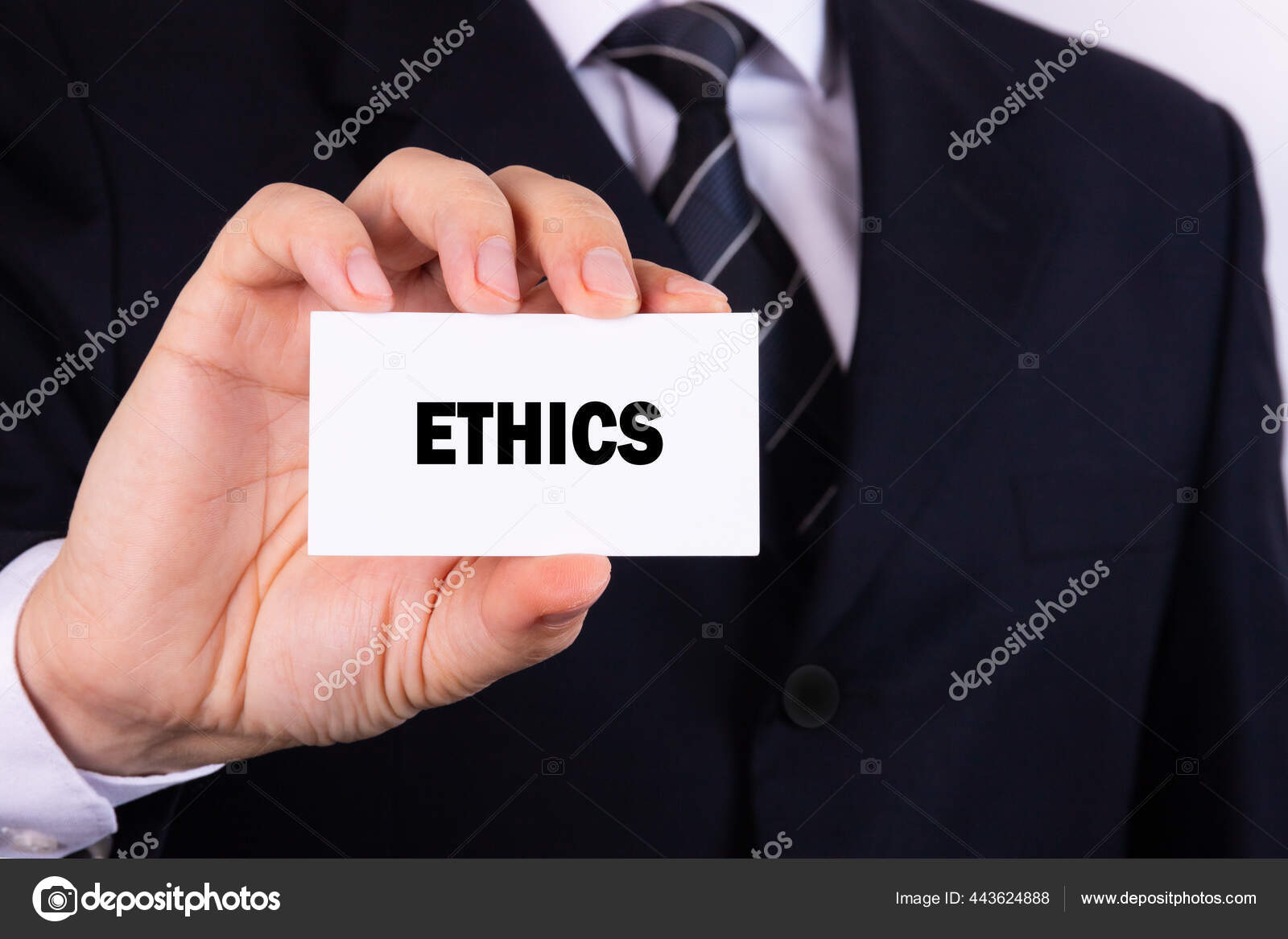 Businessman Holding Card Text Ethics — Stock Photo © Vadzim #443624888