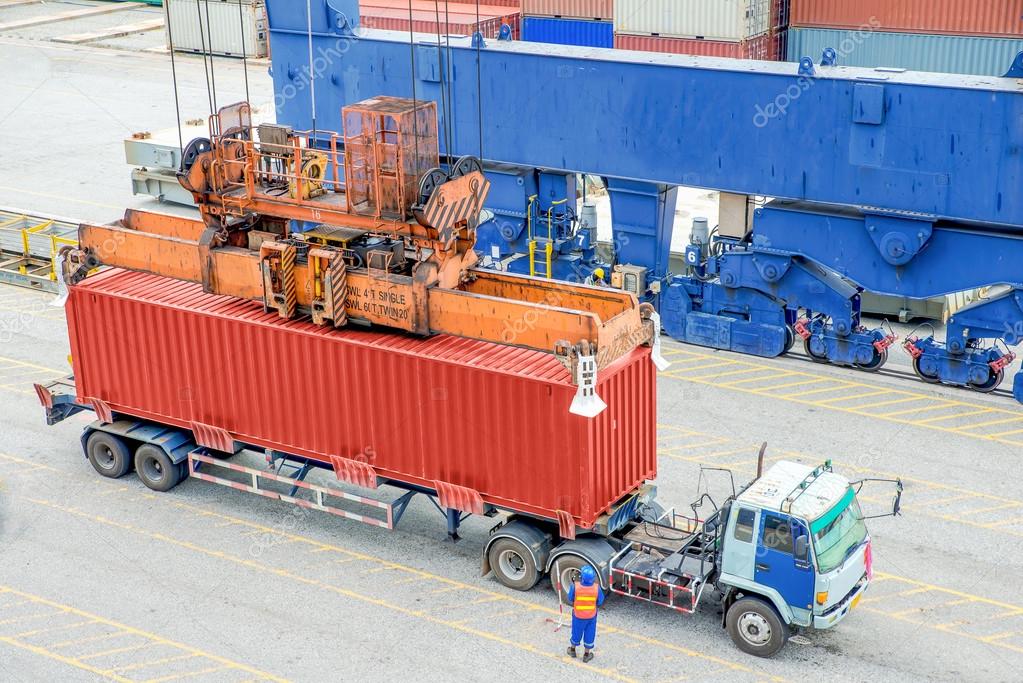 Container truck waiting for loading container box to Cargo ship Stock ...