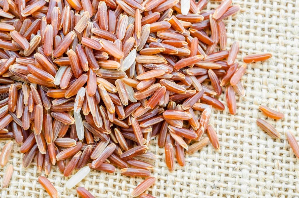 Red rice on sack. Stock Photo by ©gamjai 111883786