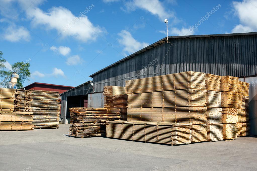 Piles of stacked rough cut lumber at a sawmill Stock Photo by ...