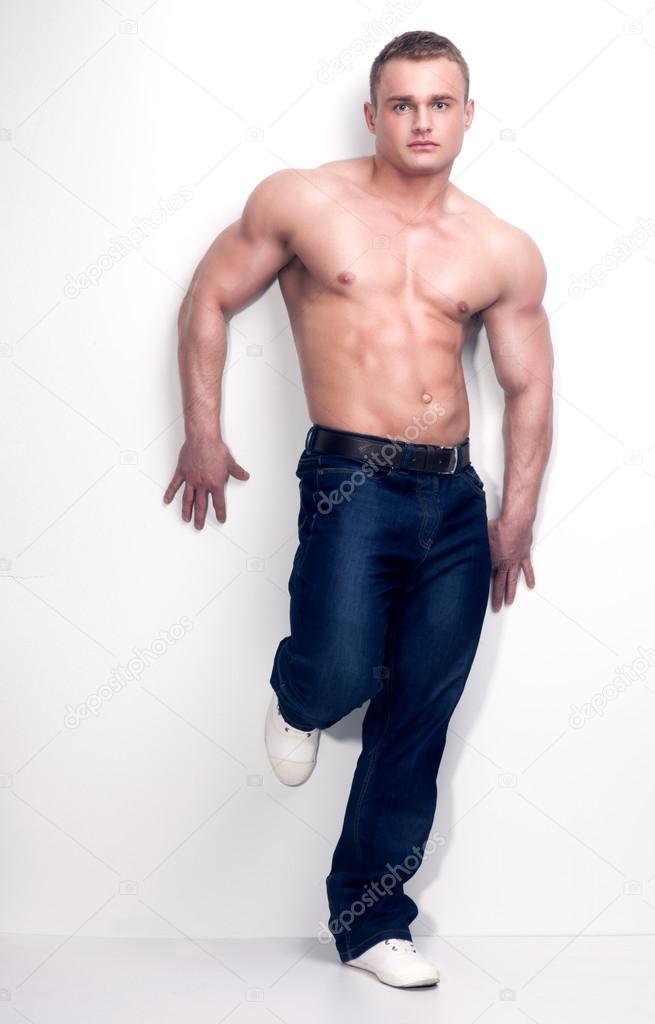 Muscular bodybuilder in studio. Stock Photo by ©NeonShot 68801245