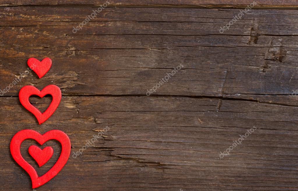 Rustic hearts on a wooden background Stock Photo by ©karissaa 63005573
