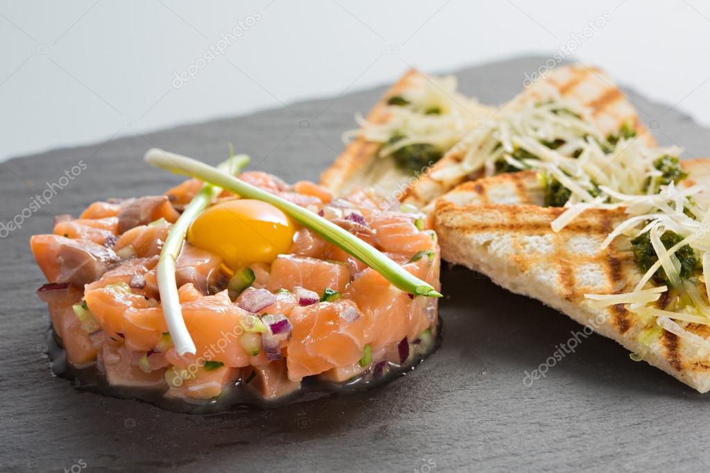 Fish tartare with quail egg Stock Photo by ©kopitin 108532860