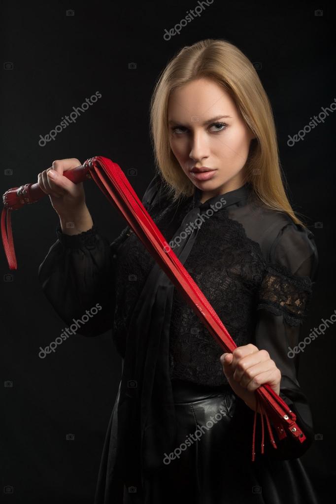 Beautiful woman in biting red whip — Stock Photo © kopitin #73439953