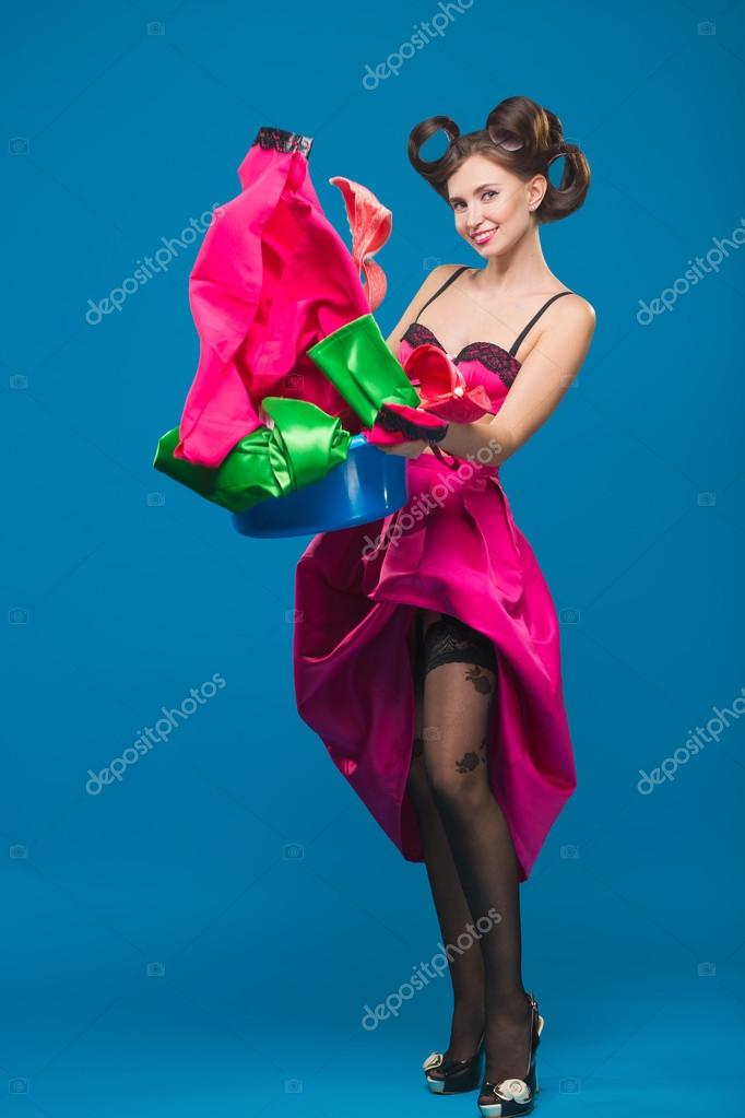Pin-up girl with a basket with the laundry Stock Photo by ©kopitin 84212144