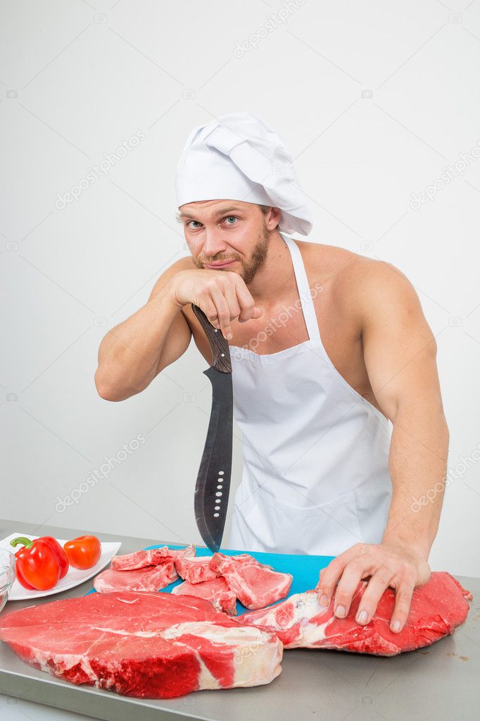Chef bodybuilder preparing large chunks of raw meat. Stock Photo by ...