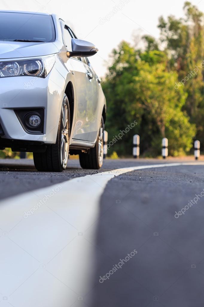 Front of new silver car parking on the asphalt road Stock Photo by ...
