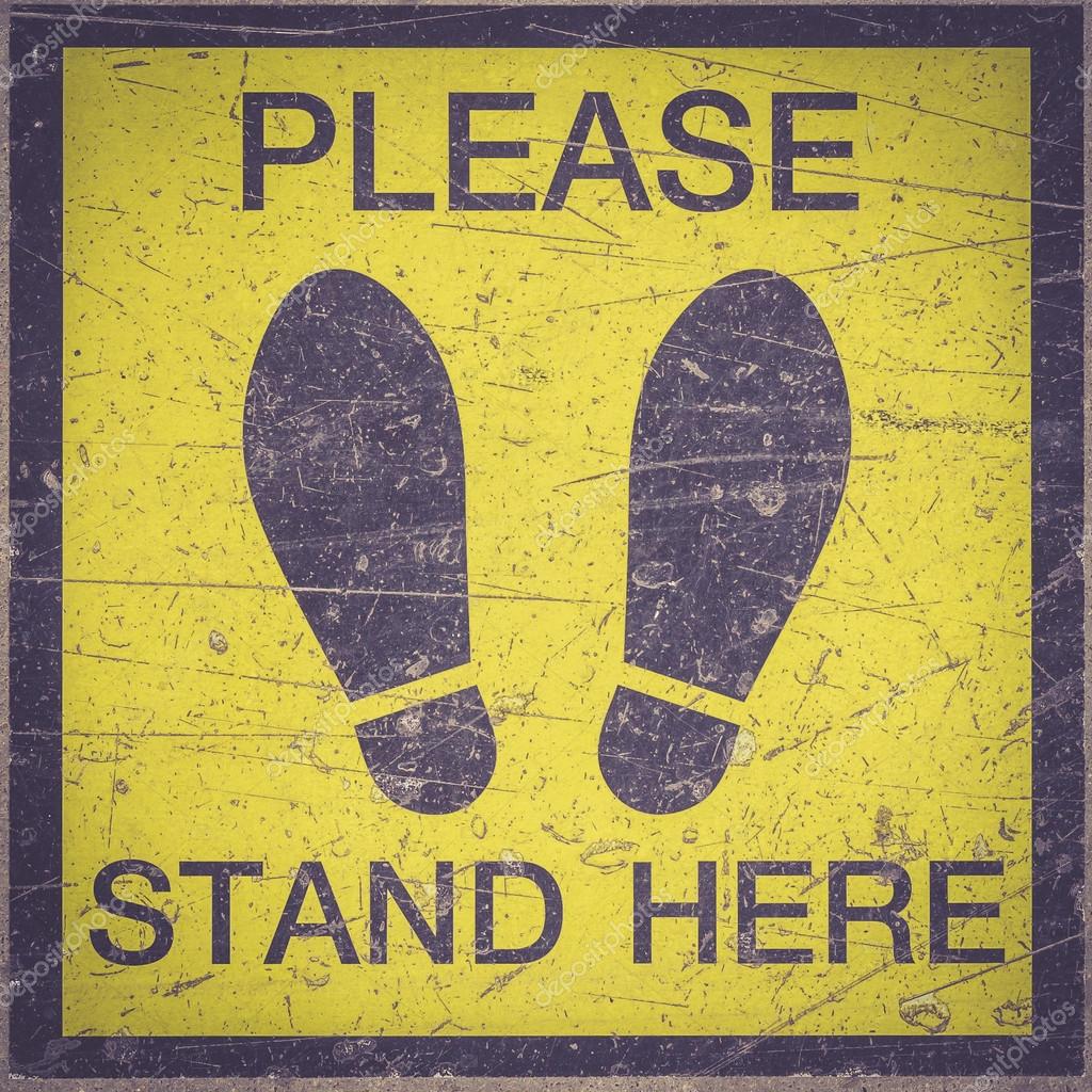 PLEASE STAND HERE foot sign — Stock Photo © PhanuwatNandee #66584933