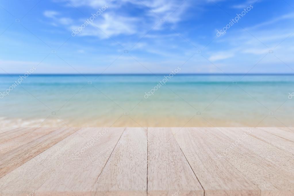 Wooden table and tropical beach Stock Photo by ©PhanuwatNandee 78113838