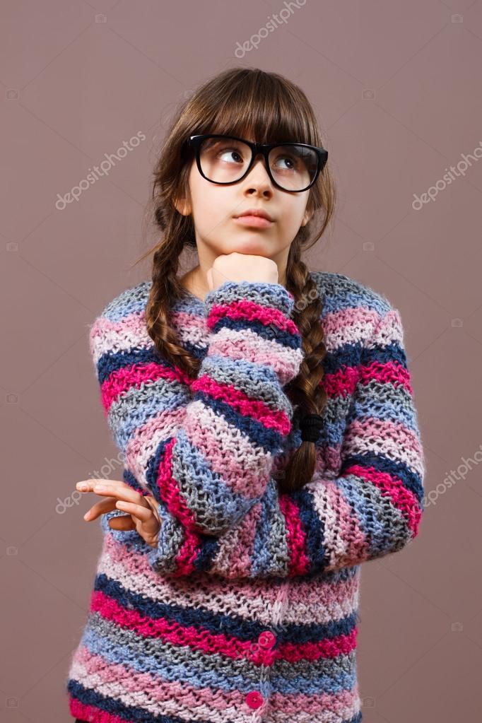 Little nerd girl thinking — Stock Photo © inesbazdar #104584188