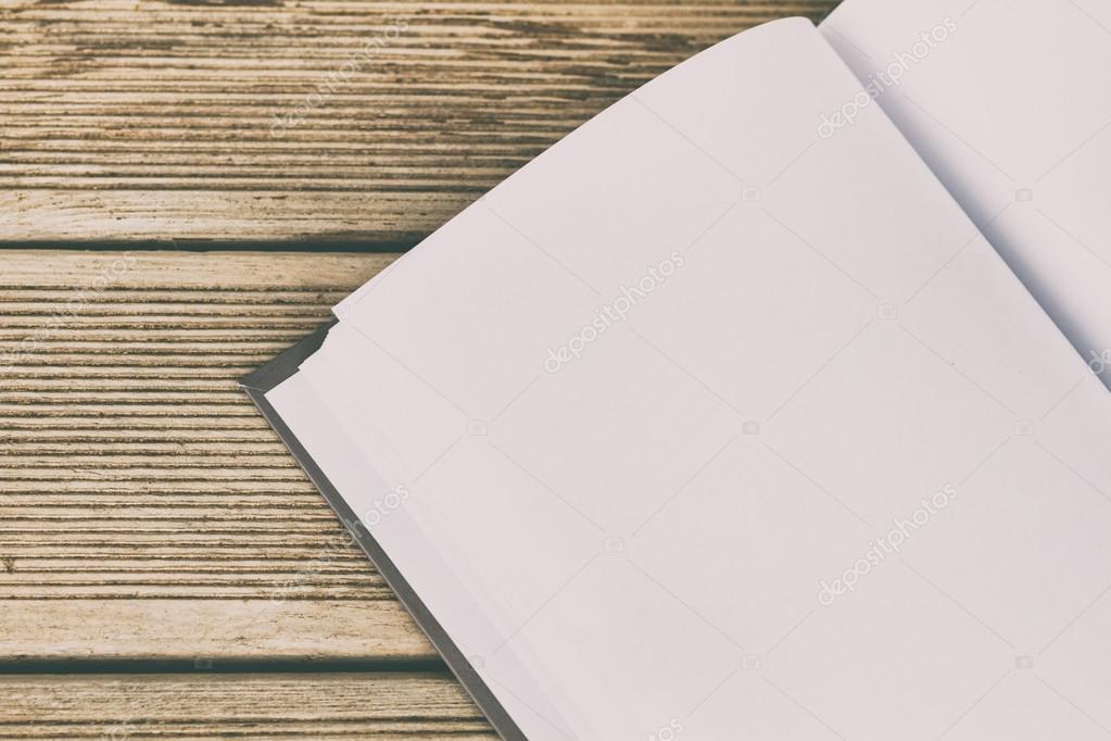 Blank book on wooden table — Stock Photo © inesbazdar #66879905
