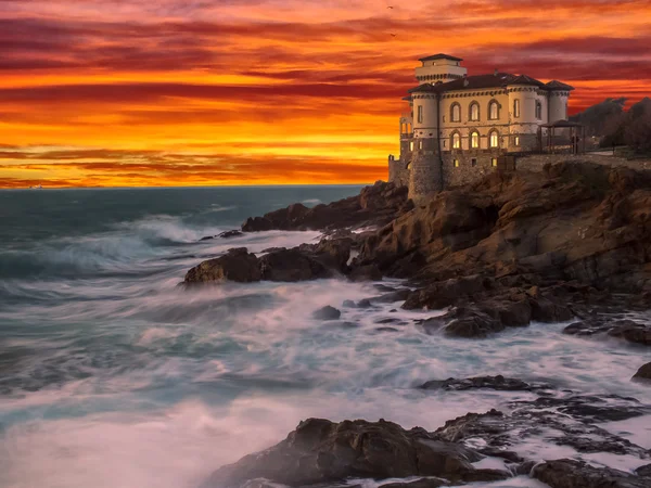 Boccale castle landmark on cliff rock and sea. Tuscany, Italy. Long ...