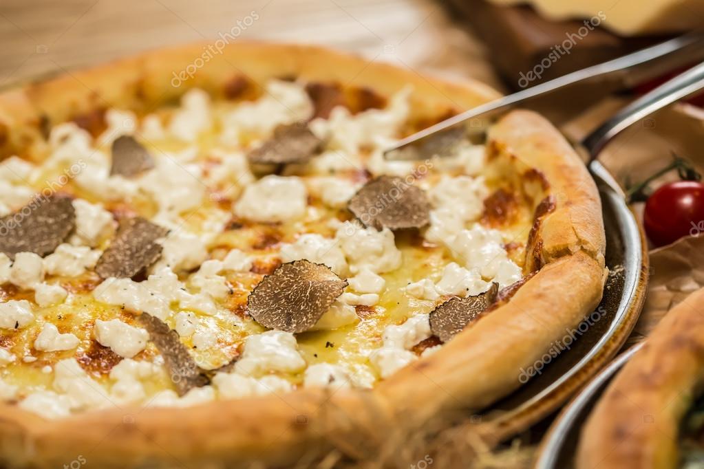 Italian pizza with truffels Stock Photo by ©sarymsakov 59121225