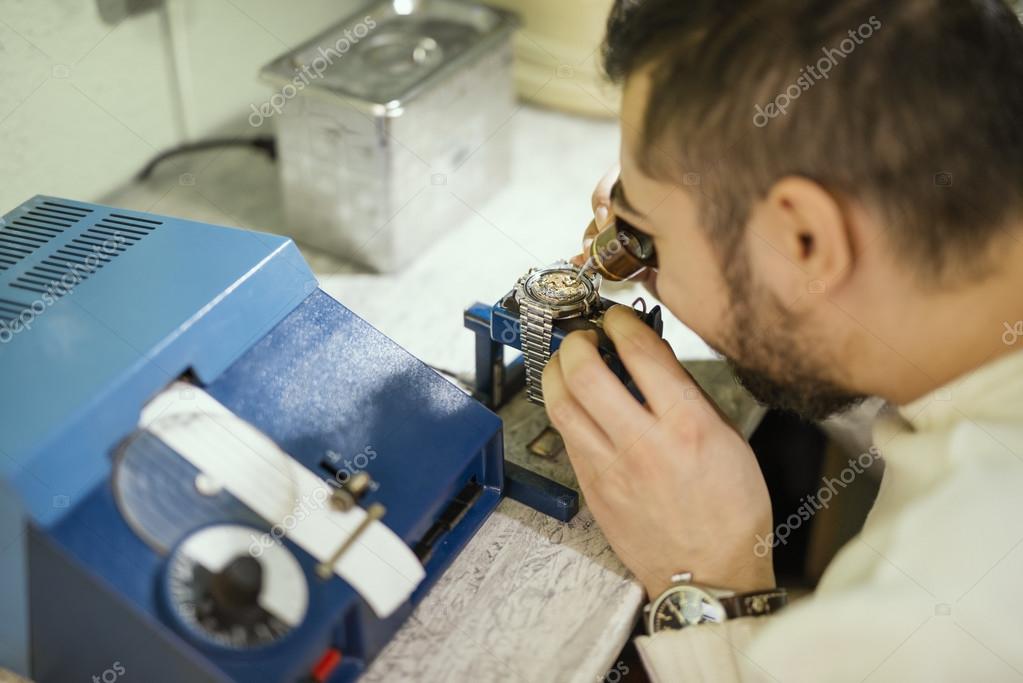 Watchmaker at work.He is working on vibrograph. Stock Photo by ...