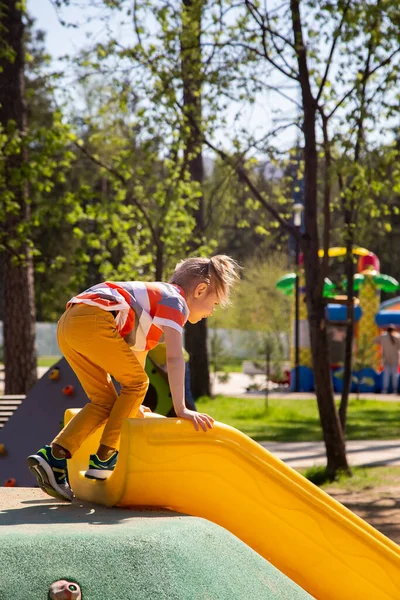 Happy children on slide Stock Photos, Royalty Free Happy children on ...