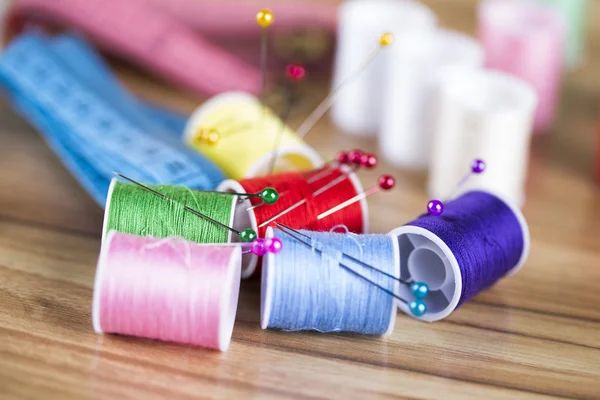 Sewing machine. Colorful threads, needles, pins, buttons. - Stock Image ...