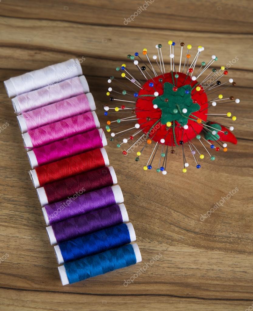 Sewing kit. Colored thread, pins, buttons, ribbons, safety pin. — Stock ...