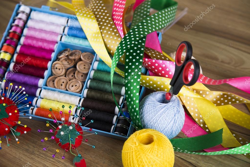Sewing kit. Colored thread, pins, buttons, ribbons, safety pin. Stock ...