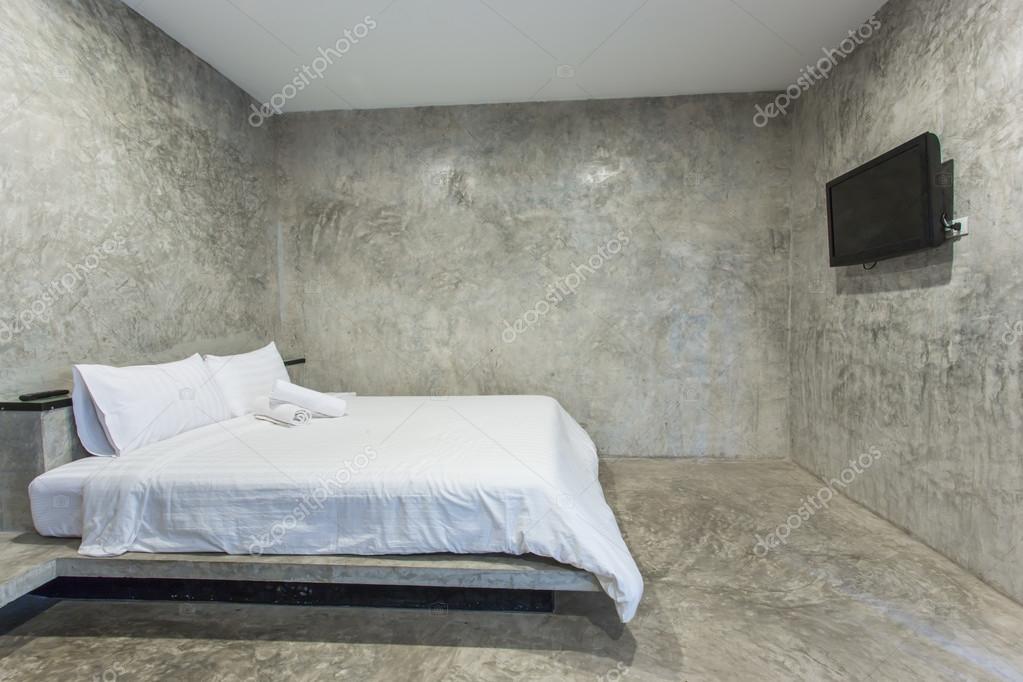 White bed with gray cement wall Stock Photo by ©hatchapong 57882689