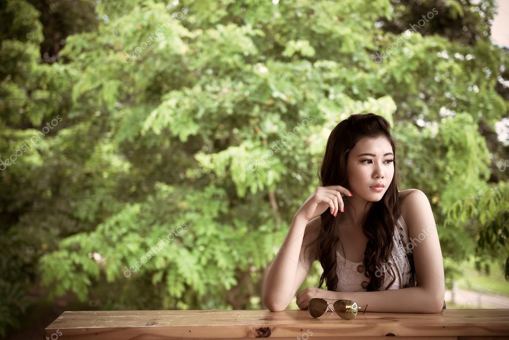 Smart asian girl thinking something — Stock Photo © kikujungboy #68818119