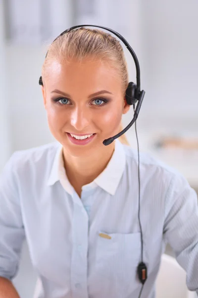 Close-up portrait of a customer service agent sitting at office - Stock ...