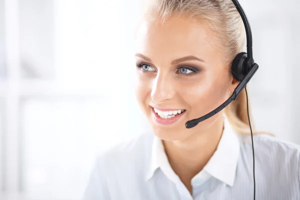 Close-up portrait of a customer service agent sitting at office - Stock ...