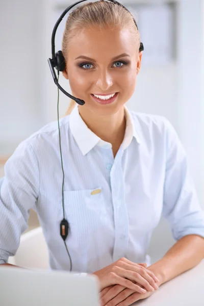 Close-up portrait of a customer service agent sitting at office - Stock ...