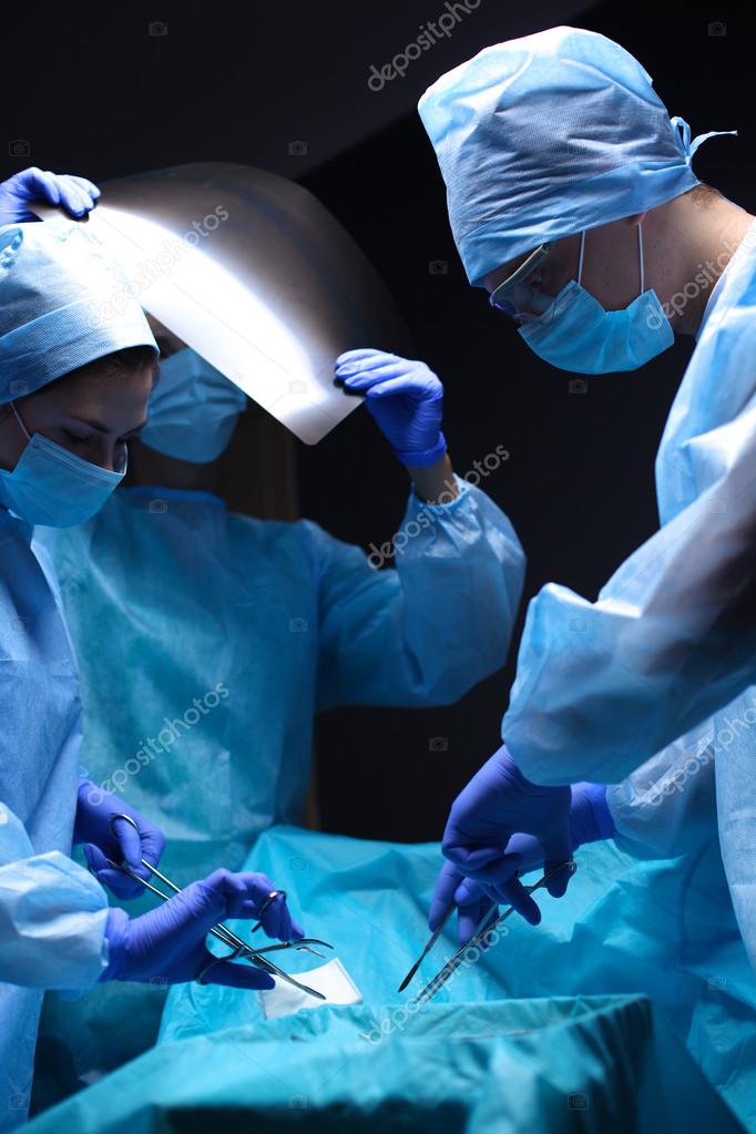 Team surgeon at work in operating room. — Stock Photo © Lenets_Tatsiana ...