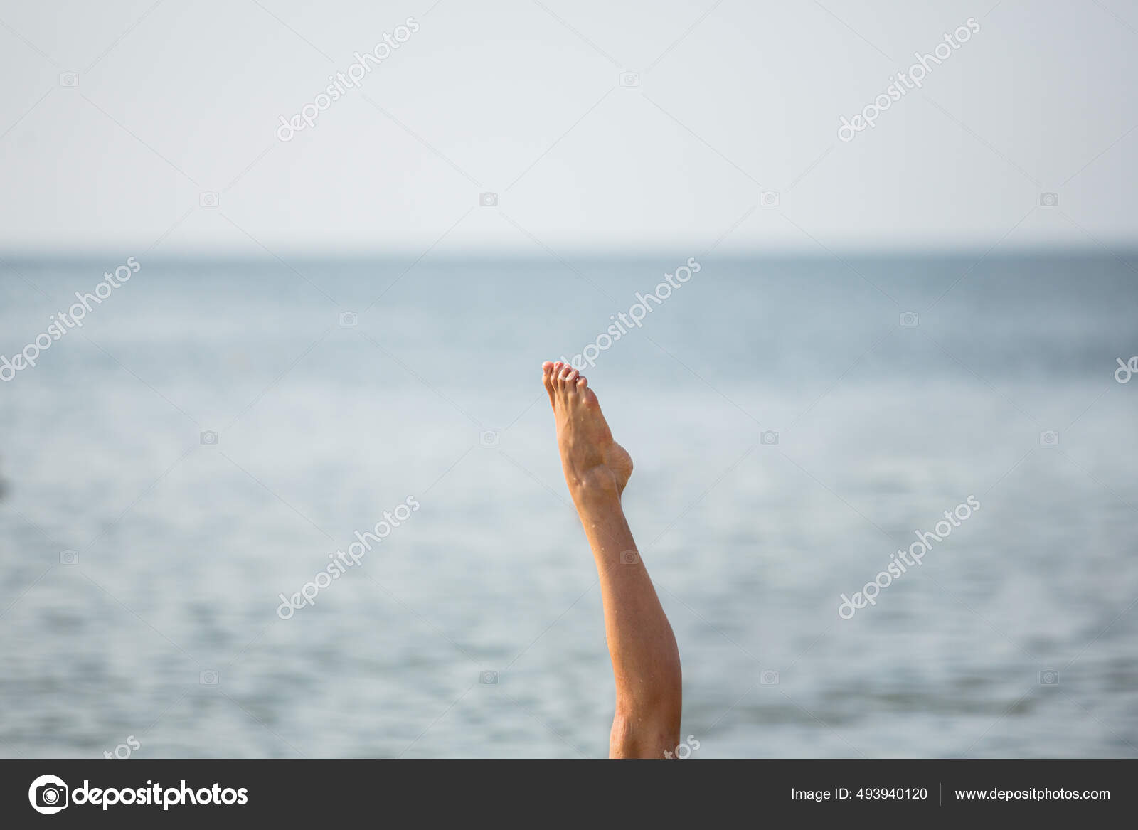 Female Legs Sea Background Stock Photo by ©HappyCity 493940120