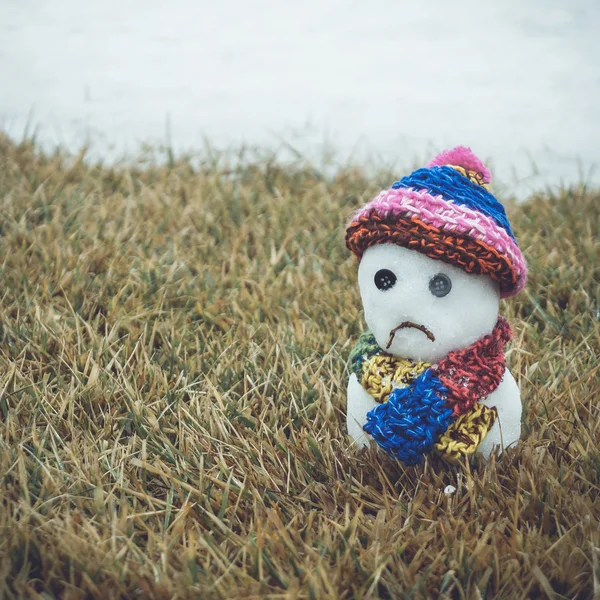 Sad snowman with hat and scarf Stock Photo by ©HappyCity 41042825