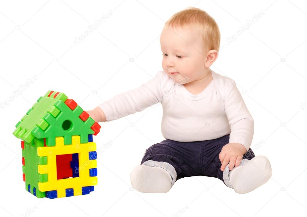 Baby boy playing with building puzzle Stock Photo by ©Cheese_78 81163328