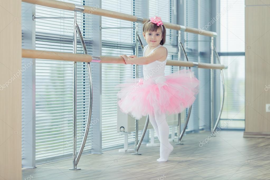 Adorable child dancing classical ballet in studio. Stock Photo by ...