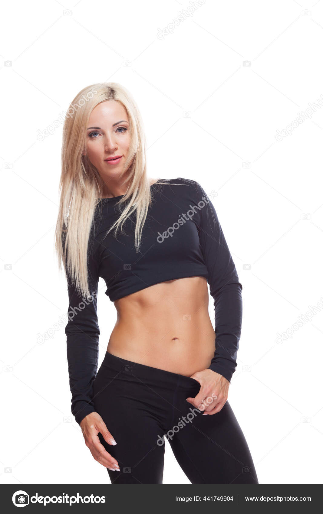 Blonde Fitness Woman Standing And Showing Off Her Toned And Muscular Athletic Body Isolated On