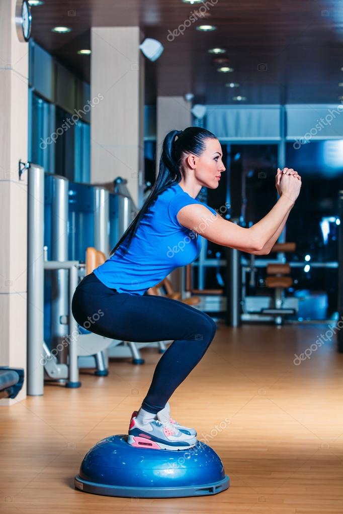Young woman performing Step aerobics exercises in the gym. Stock Photo ...
