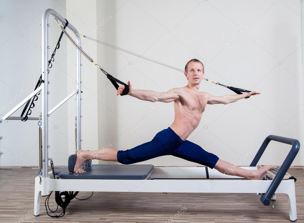 Pilates reformer workout exercises man at gym indoor — Stock Photo ...