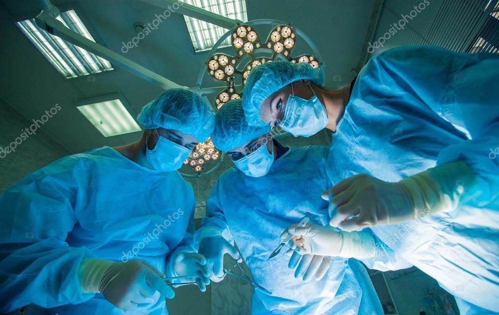 Surgeons standing above of the patient before surgery Stock Photo by ...