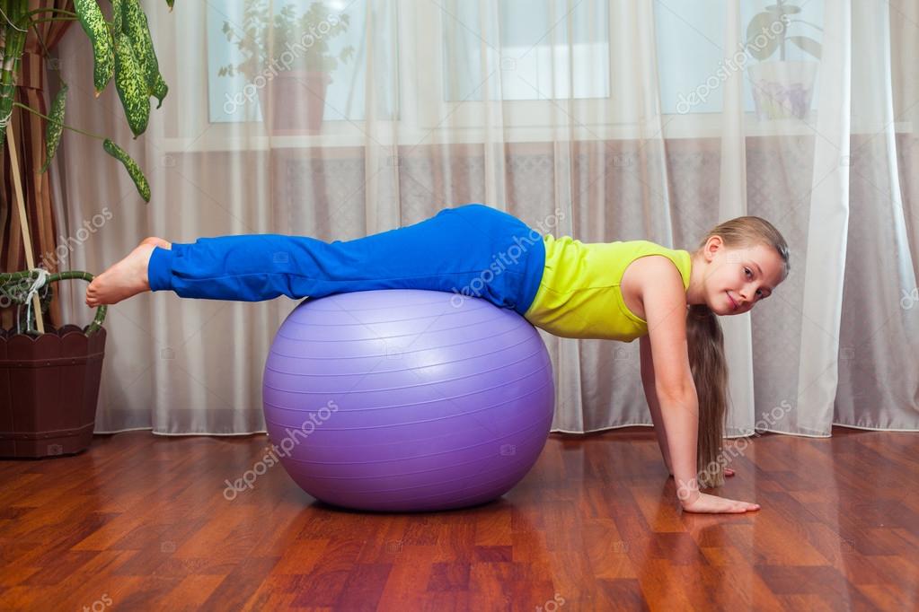 Child with on the ball for fittnesa at home Stock Photo by ©satyrenko ...