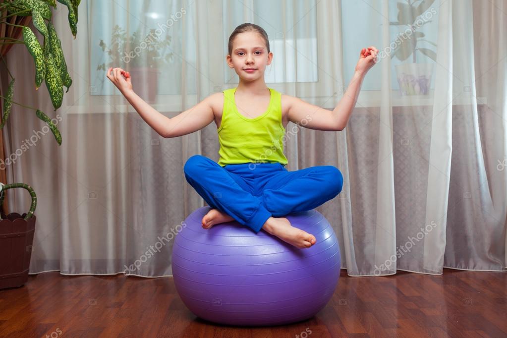 Child with on the ball for fittnesa at home Stock Photo by ©satyrenko ...