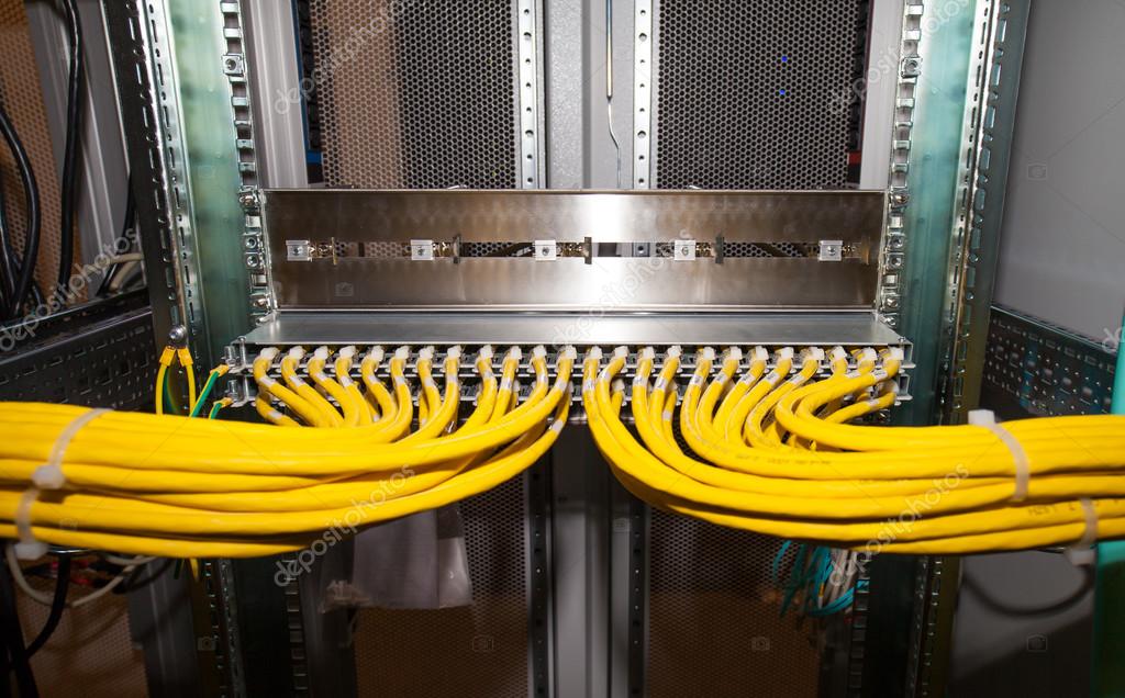 LAN network distributor in a server rack for network services — Stock ...