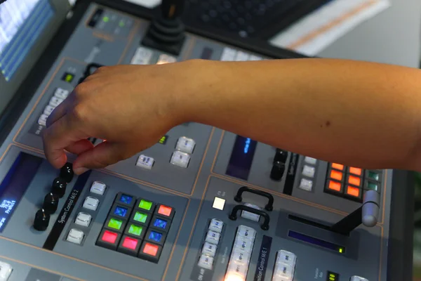 TV engineer working editing with video and audio mixer — Stock Photo ...