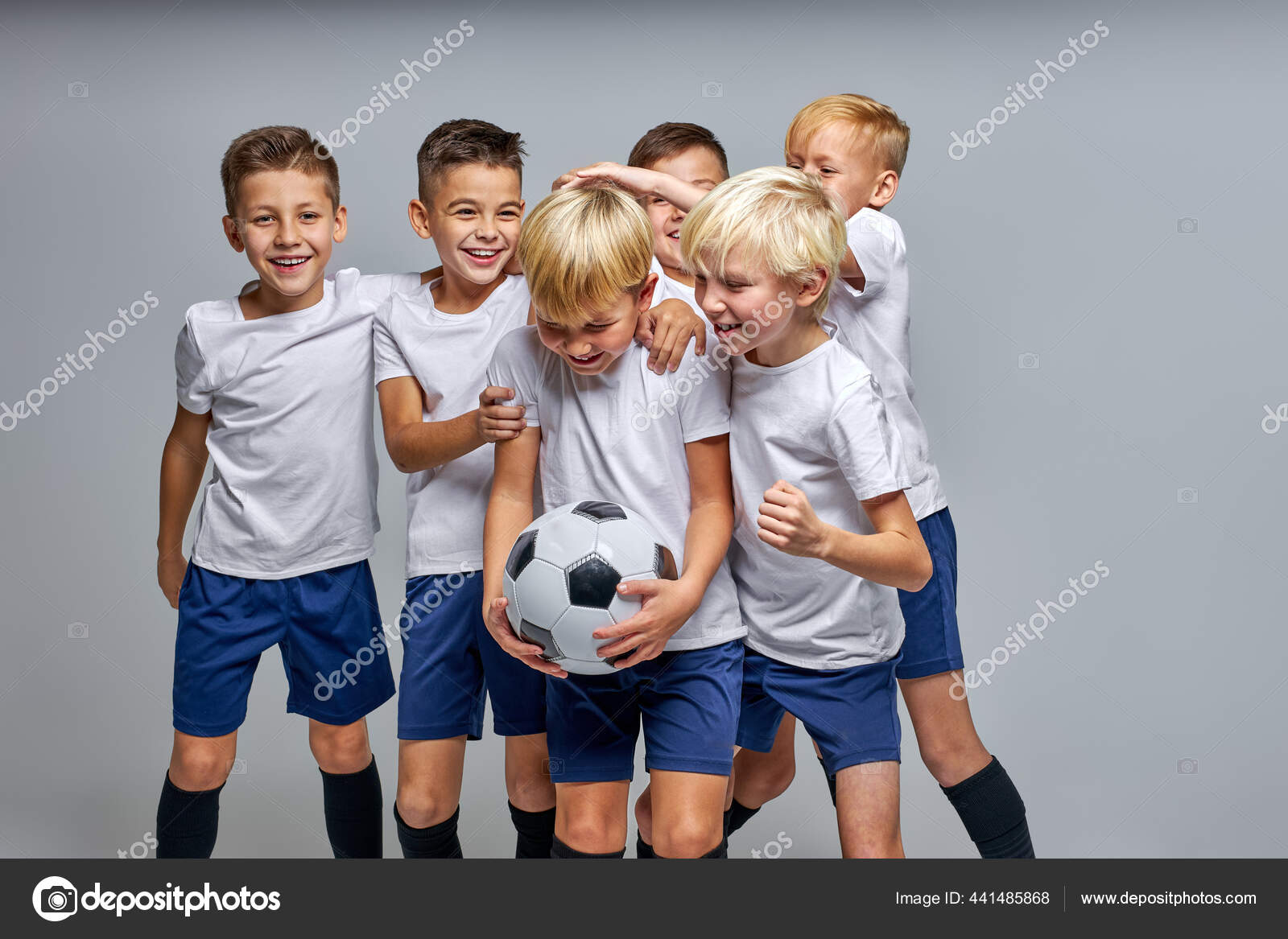 Cheerful soccer team, children have fun celebrating Stock Photo by ©romanchazov27 441485868