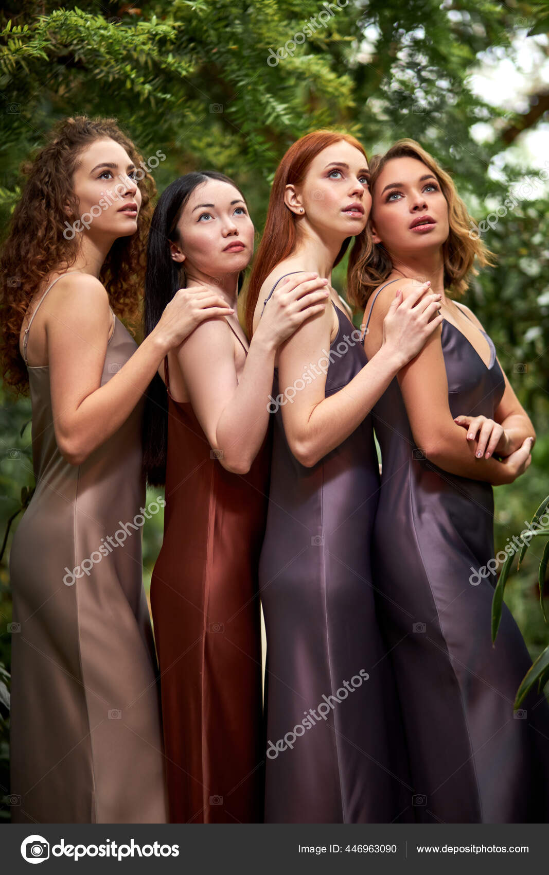 Female models stand behind each other in contemplation of nature around ...