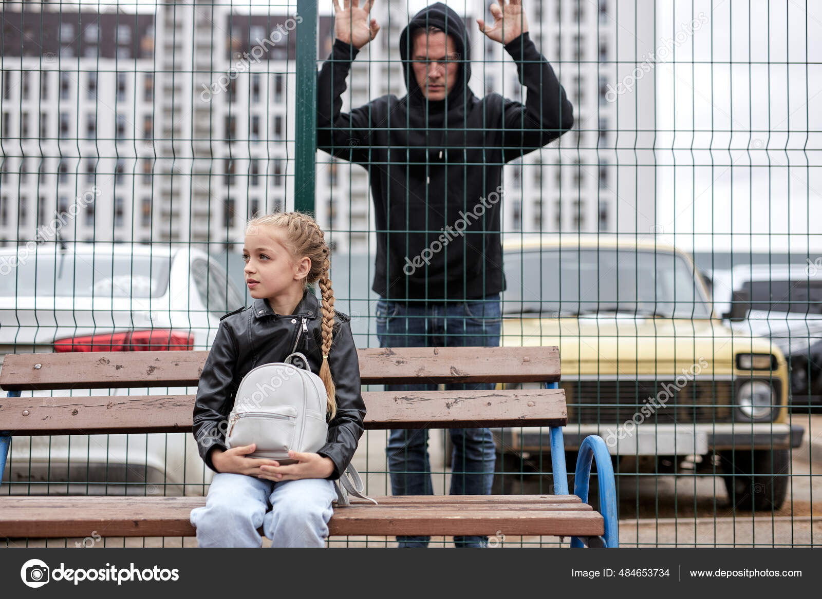Maniac watching at child sitting on playground alone, while walking ...