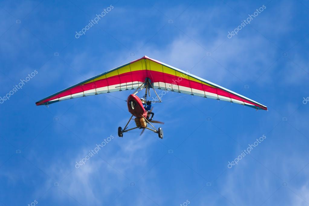 Delta wing with engine flies by the blue sky — Stock Photo ...