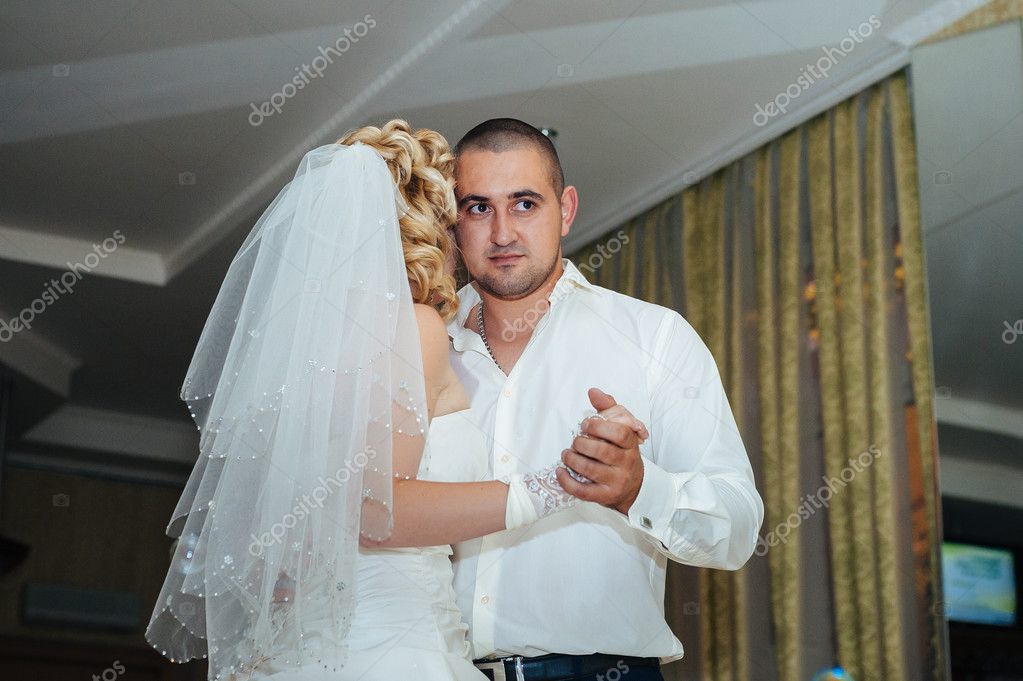 Wedding dance of bride and groom. Charming bride and groom on their ...