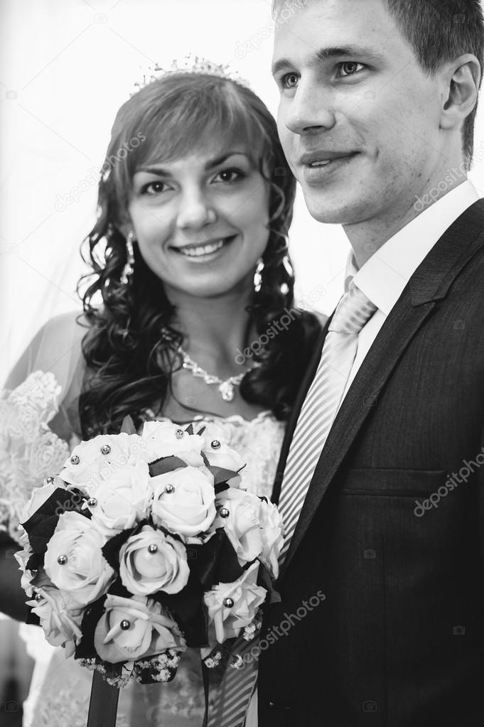 Handsome groom first time meets his bride at her house on a wedding day ...