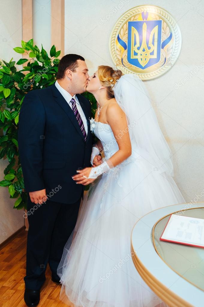 Wedding ceremony. Registry office. A newly-married couple signs the ...